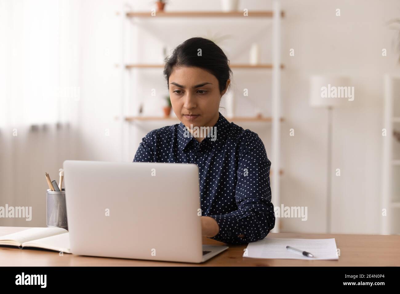 Busy indian lady freelancer typing electronic document text on pc Stock ...