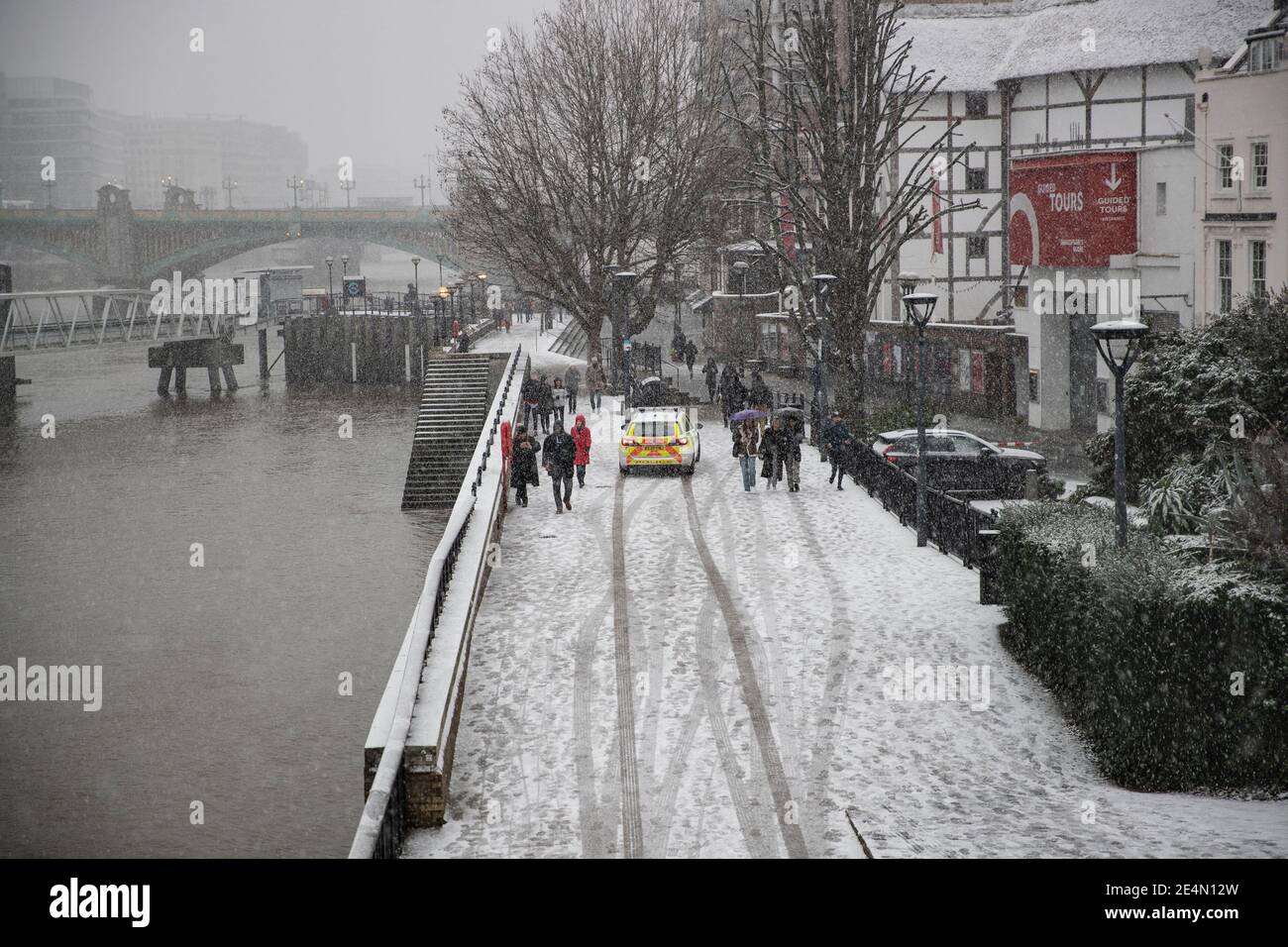 Police car seen driving past the millennium pedestrian bridge during ...