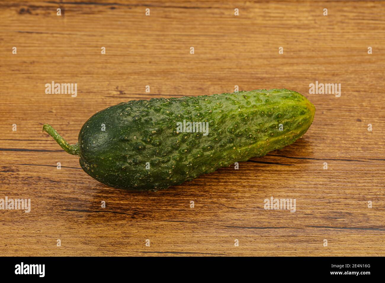 Green ripe fresh one cucumber over background Stock Photo - Alamy
