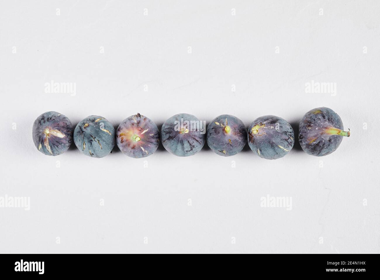 A bunch of ripe figs on a white background Stock Photo - Alamy