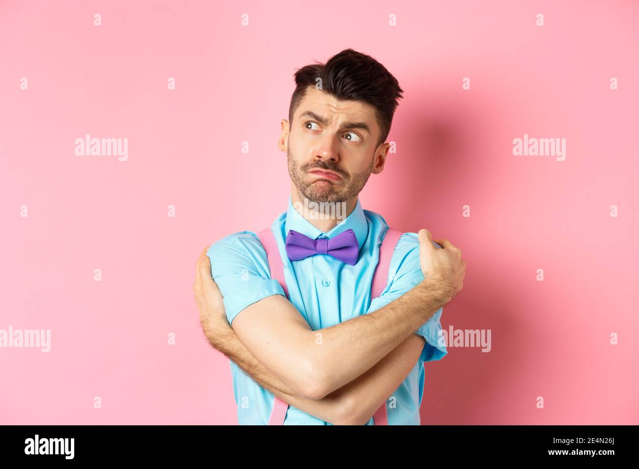 Timid guy feeling offended and lonely, embracing body, comforting ...