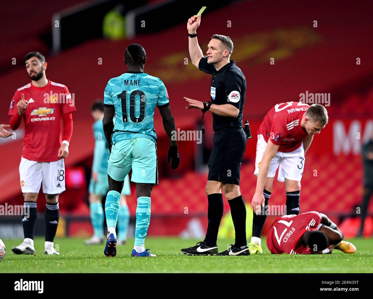 Referee craig pawson shows yellow card hi-res stock photography and images - Alamy