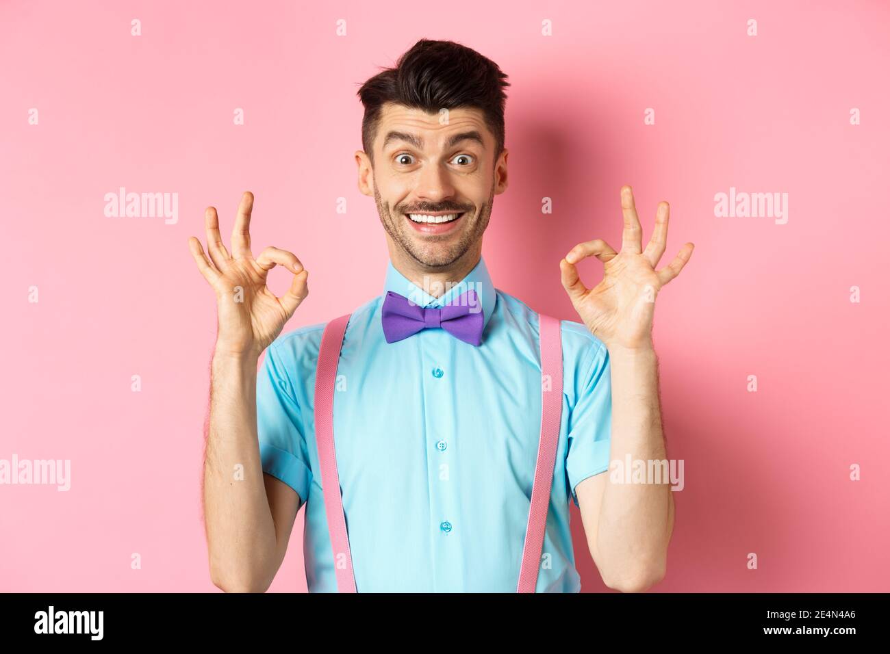 Cheerful handsome man smiling, showing okay gestures in approval ...