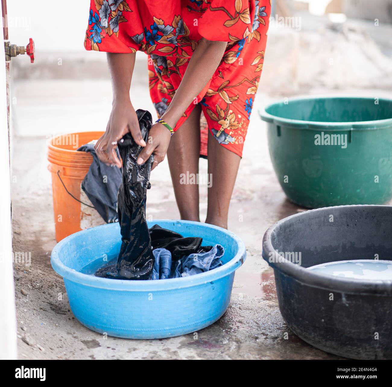 African nice woman hand washing laundry outdoors Stock Photo - Alamy