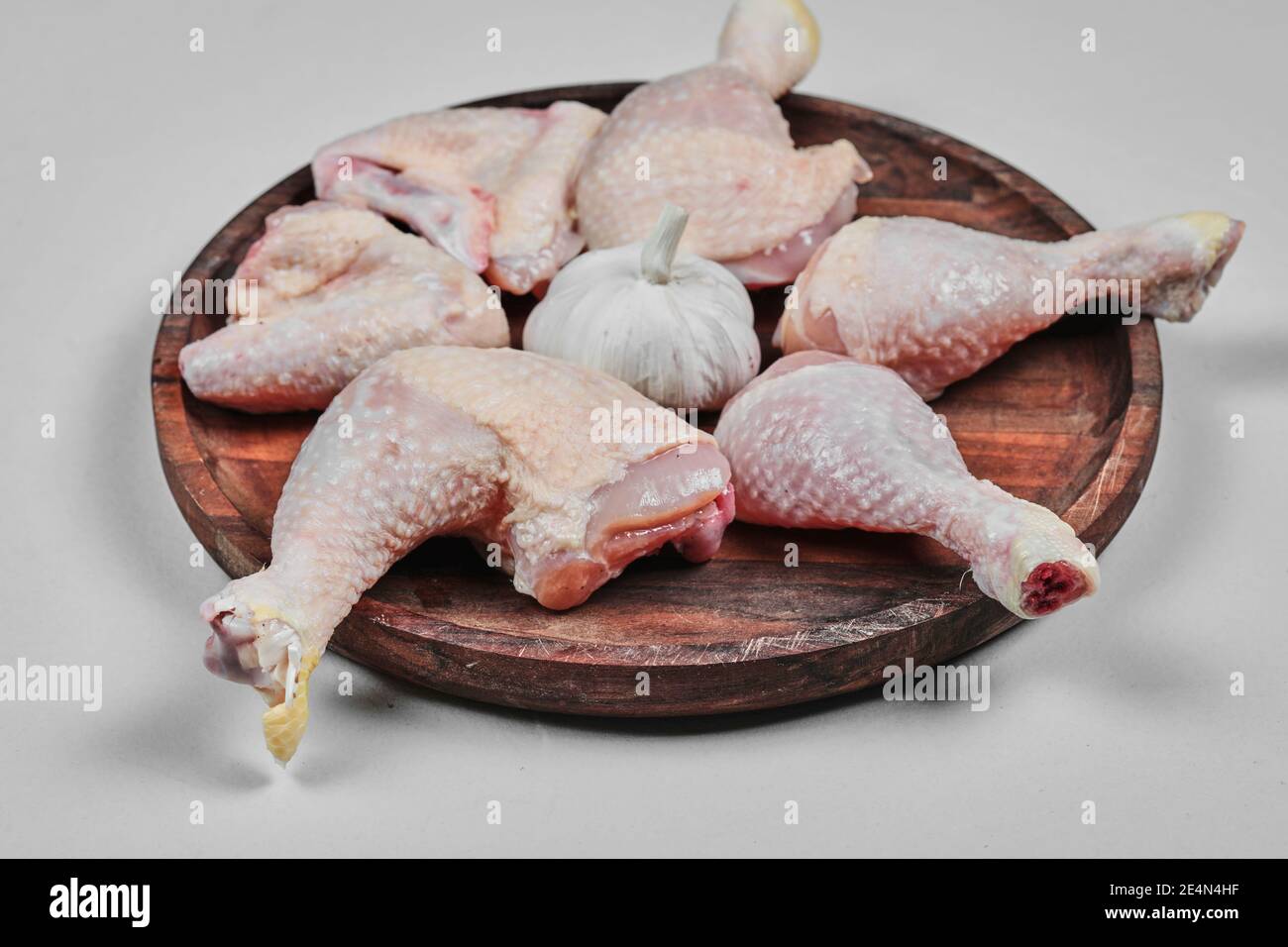 Raw chicken meat parts on wooden plate Stock Photo - Alamy
