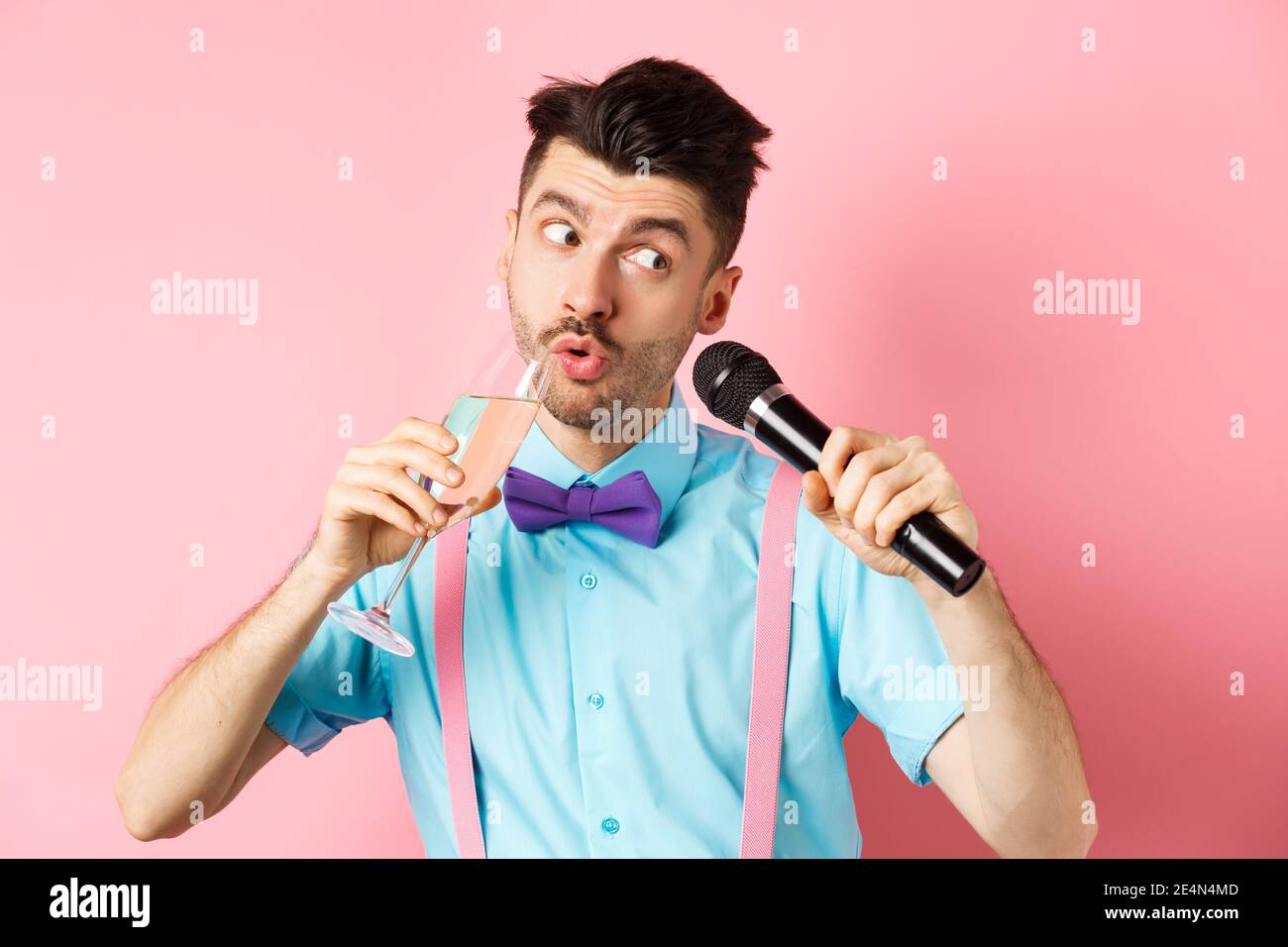 Party and festive events concept. Funny guy singing karaoke, performing ...