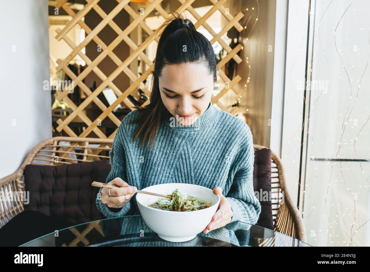 Girl eating ramen noodle soup. Asian traditional food Stock Photo - Alamy
