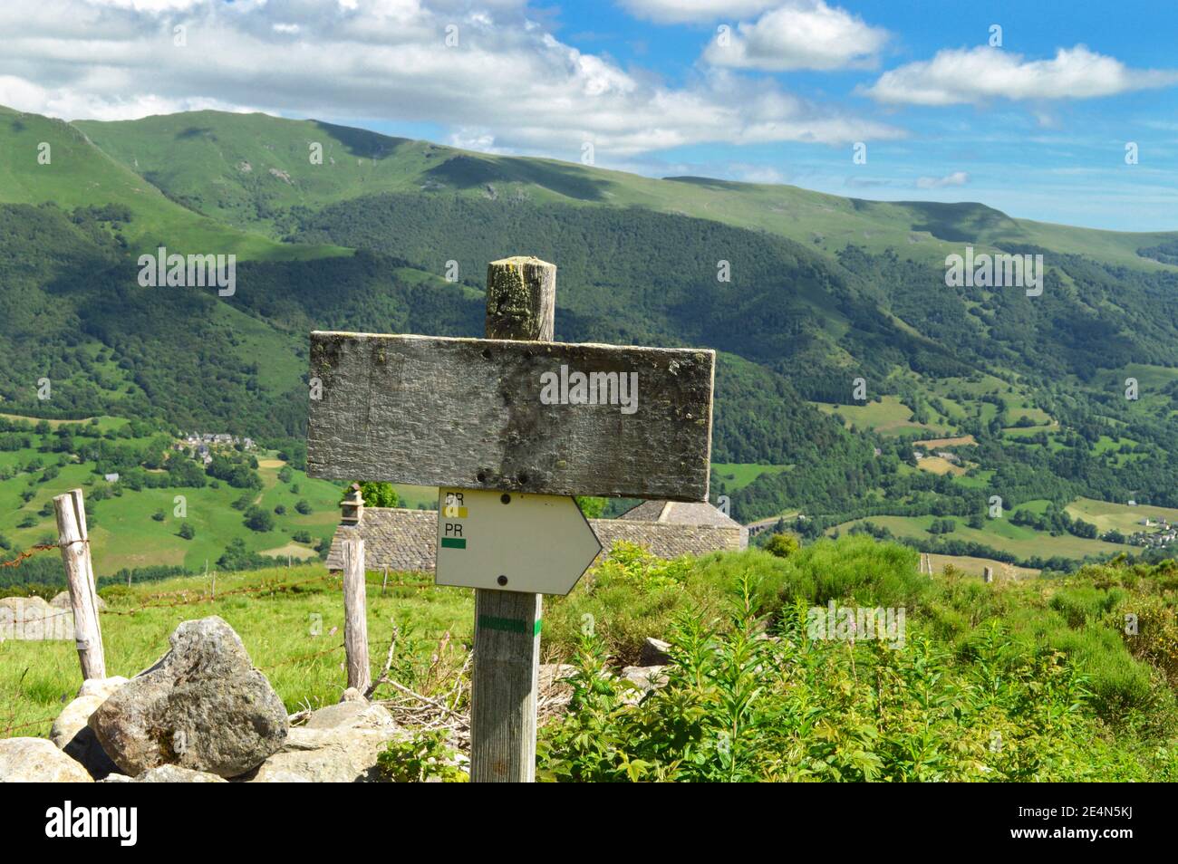 A road sign on a hiking path in the mountain, which indicates the ...