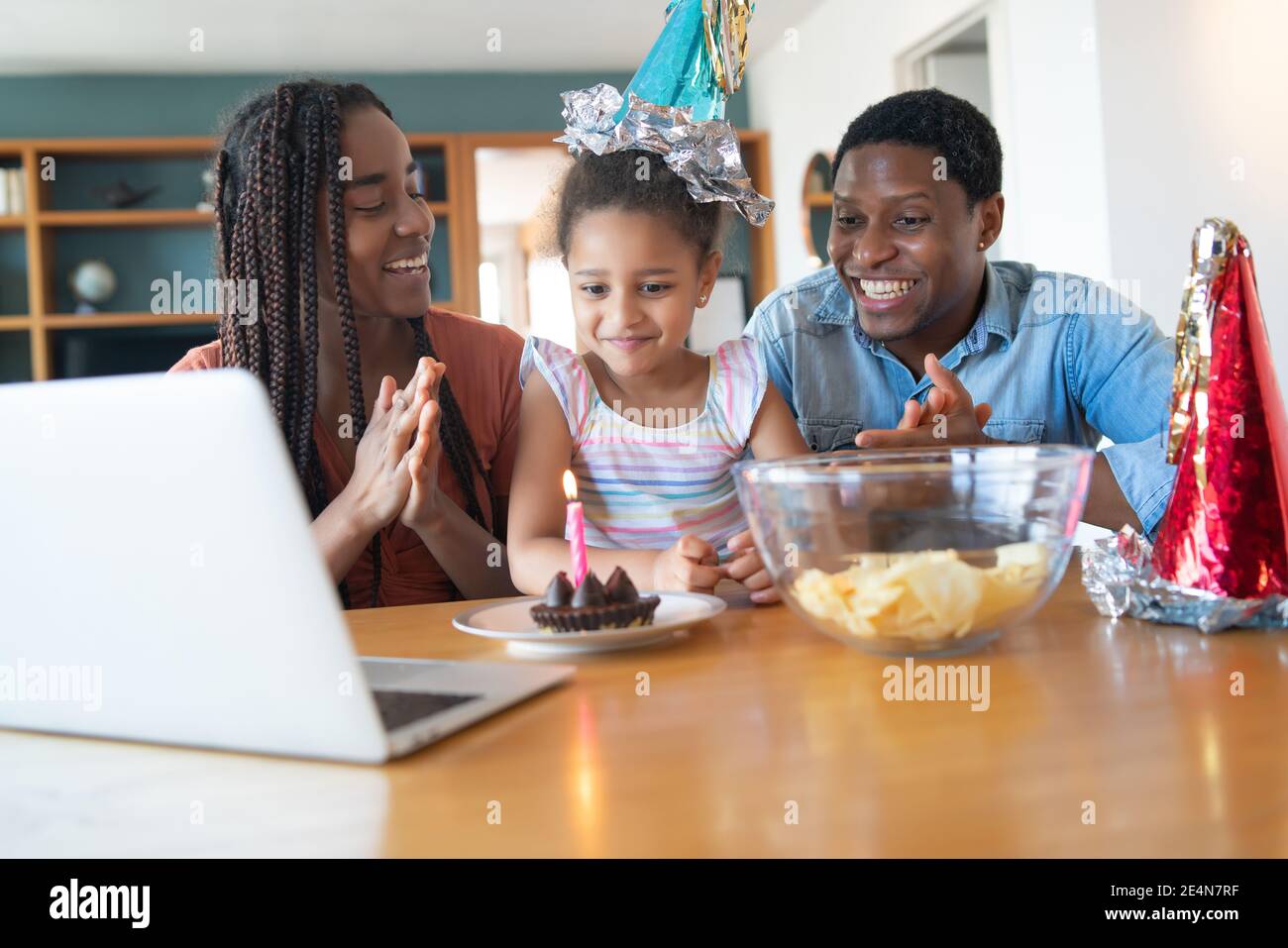 Family celebrating birthday on a video call Stock Photo - Alamy