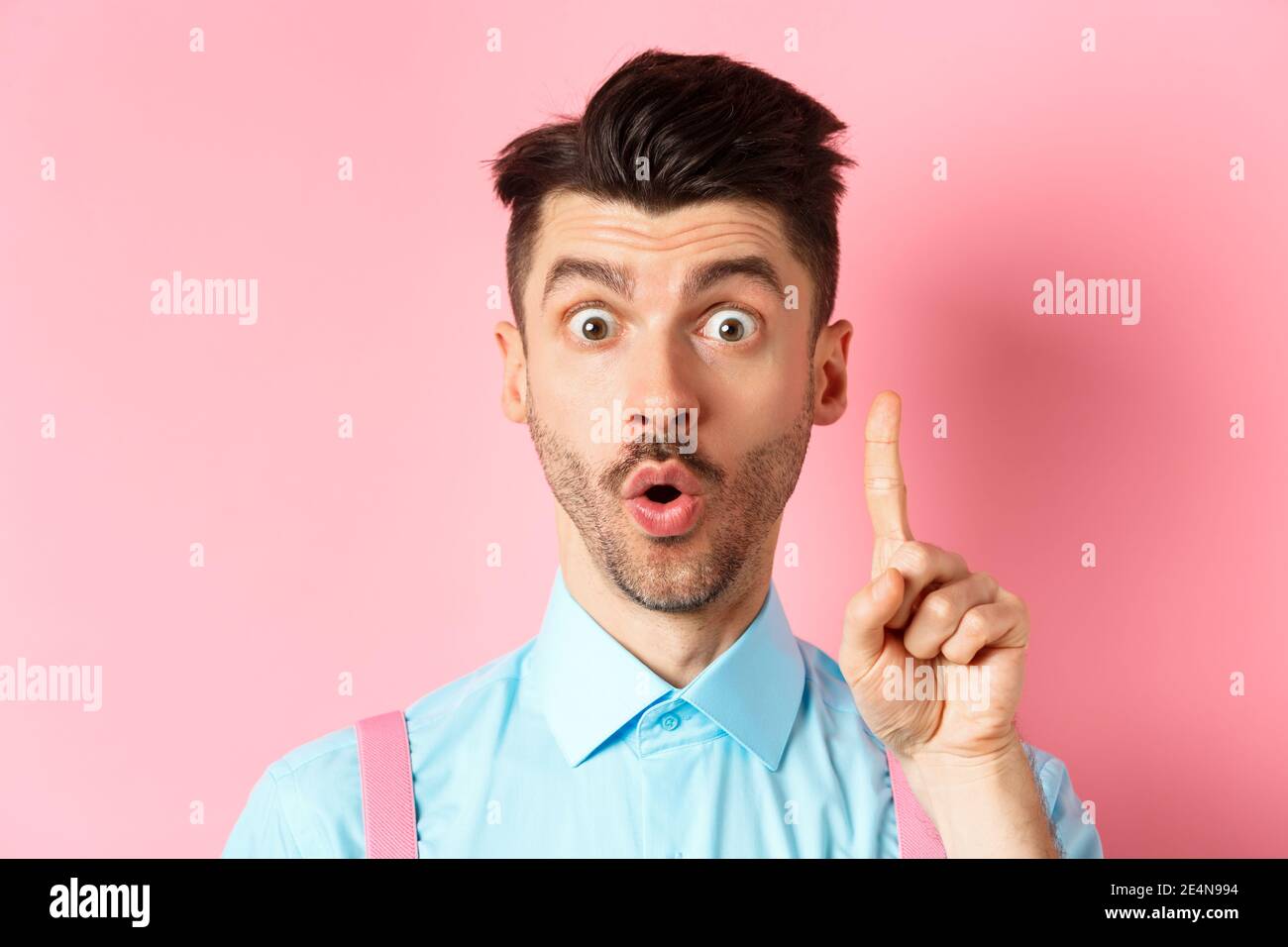Close-up of excited guy pitching an idea, raising finger and saying ...