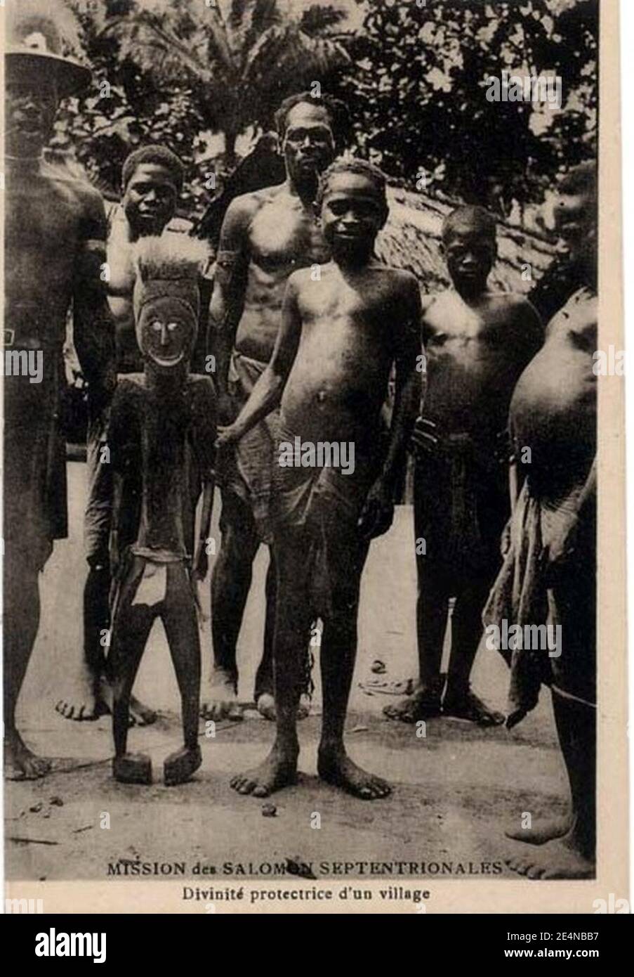 Men and boys with village wooden deity figure, Solomon Islands Stock ...