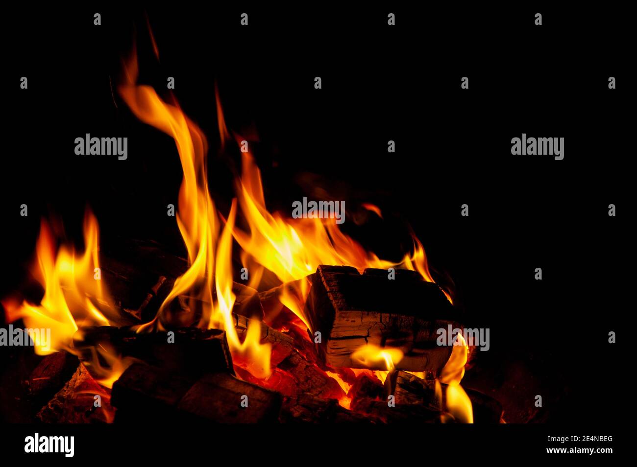 Chopped wood on fire Stock Photo - Alamy