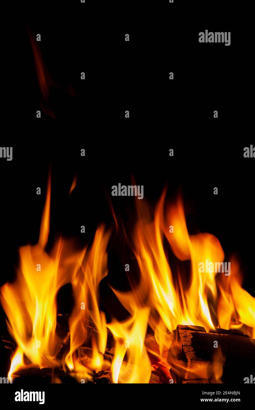 Chopped wood on fire Stock Photo - Alamy