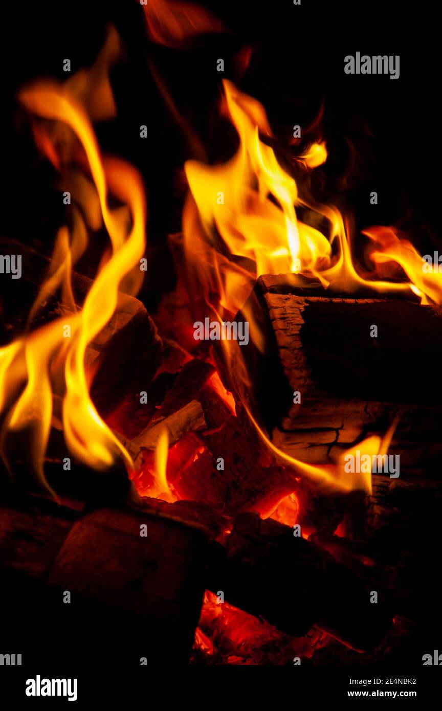 Chopped wood on fire Stock Photo - Alamy
