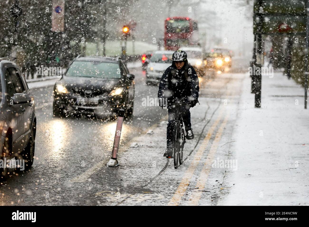 Traffic seen during the heavy snowfall in north London as large parts ...