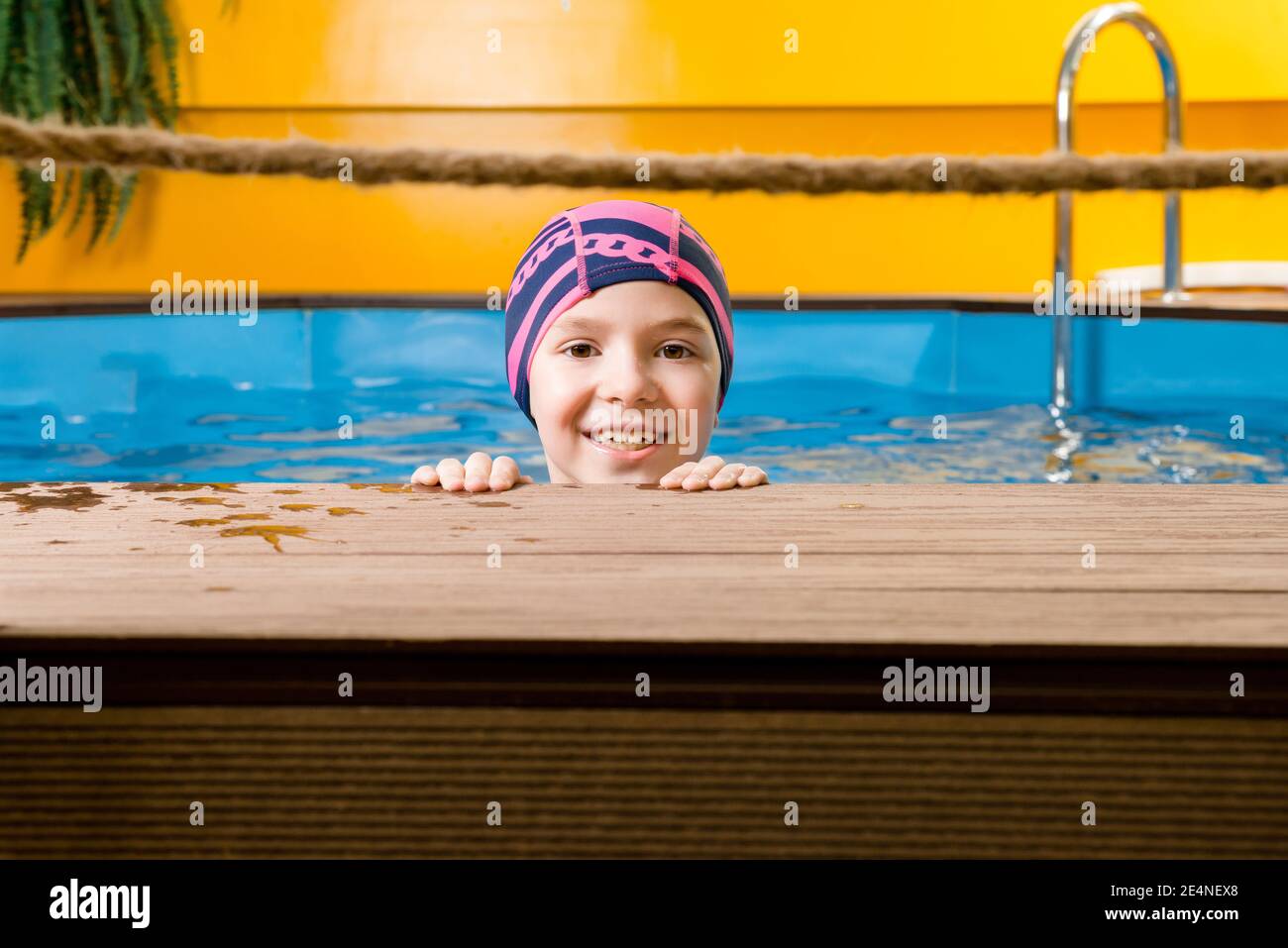 Portrait of a little girl in indoor swimming pool Stock Photo - Alamy