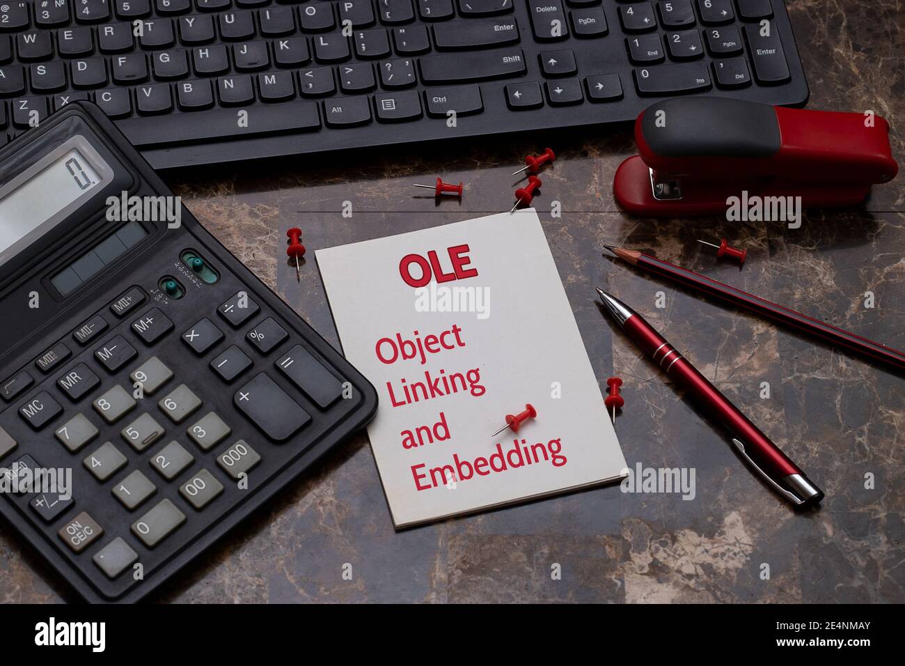 OLE, OBJECT LINKING AND EMBEDDING written on a reminder sheet on the ...