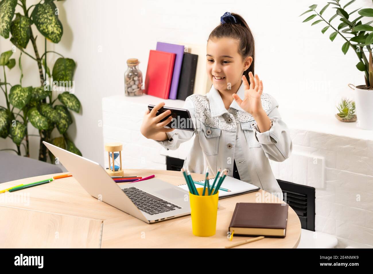 people, children and technology concept - girl with laptop computer and ...