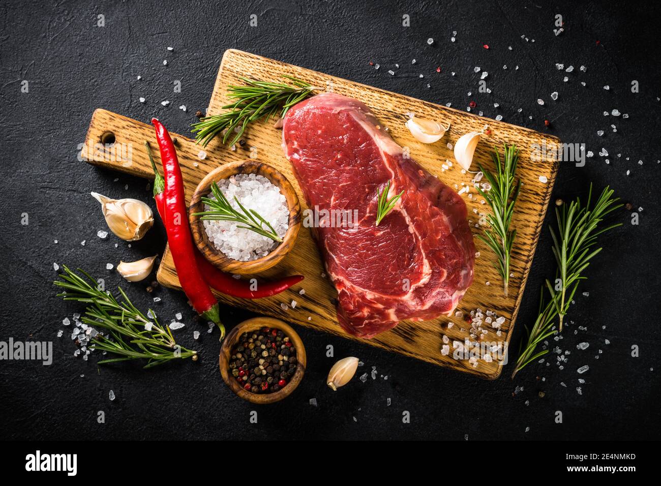 Raw beef steak with herbs Stock Photo - Alamy