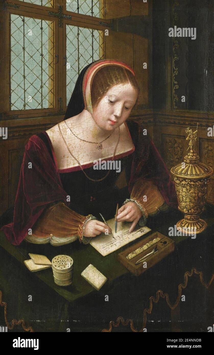 A lady writing at a desk Stock Photo - Alamy