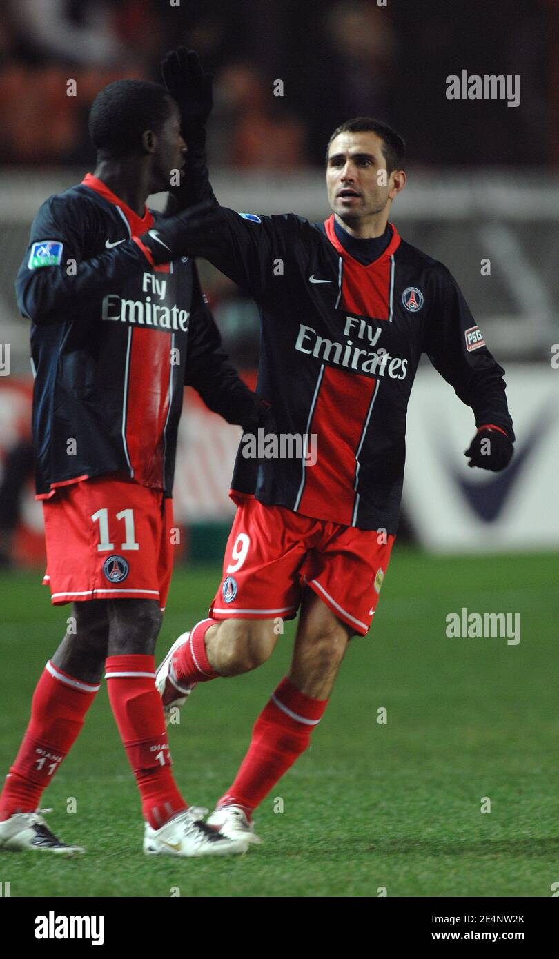 Paris' forward Pauleta congratulates Paris' Peggy Luyindula during the ...