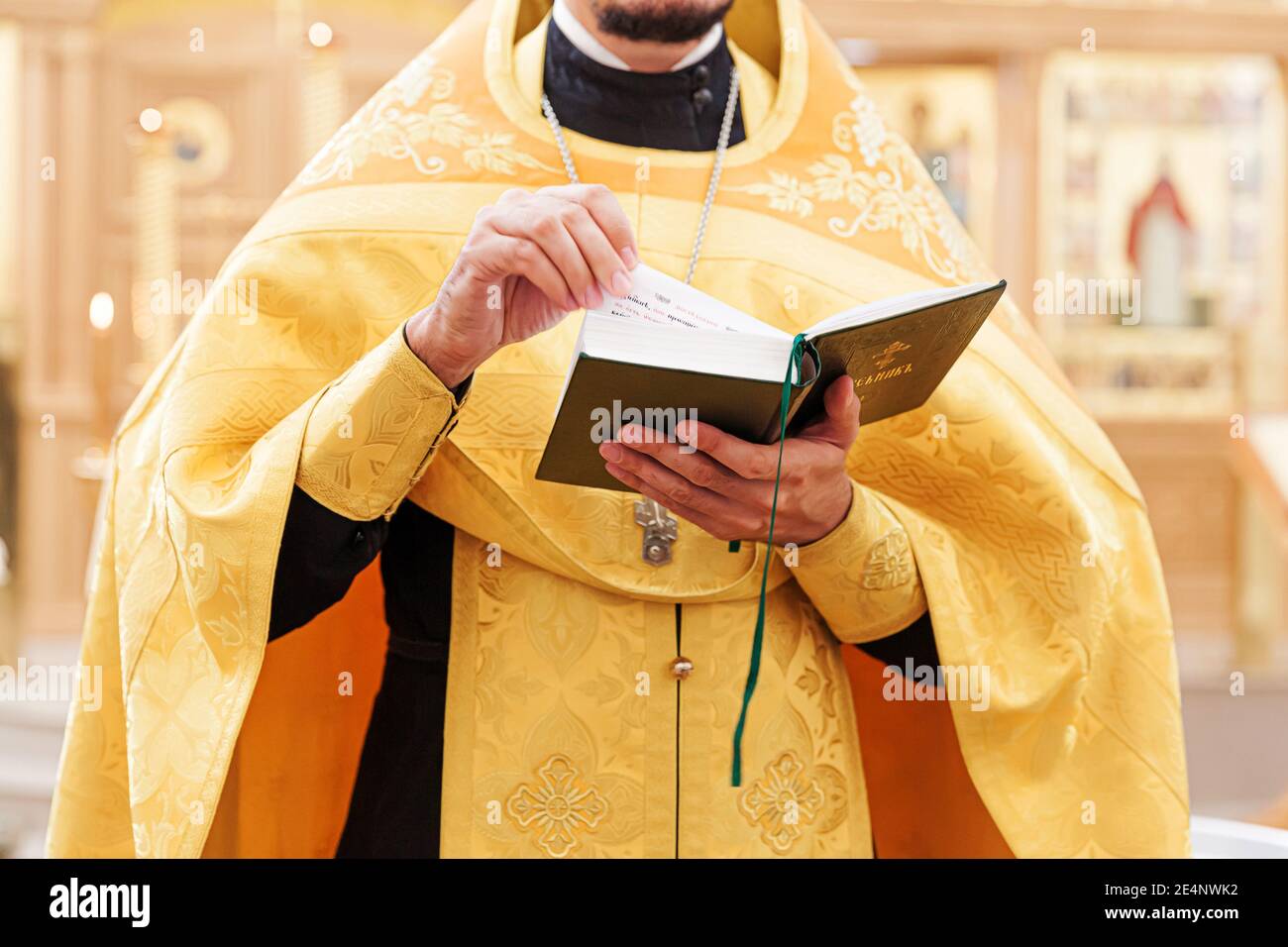 Orthodox Church. Christianity. Priest hands holding Holy Bible book in ...
