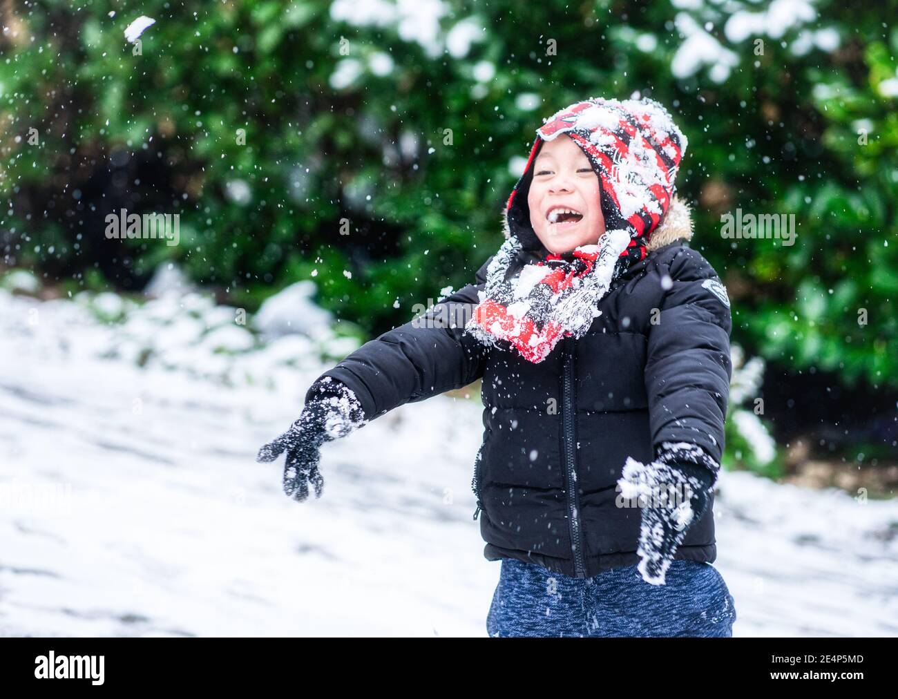 Boy playing outside in winter hi-res stock photography and images - Alamy
