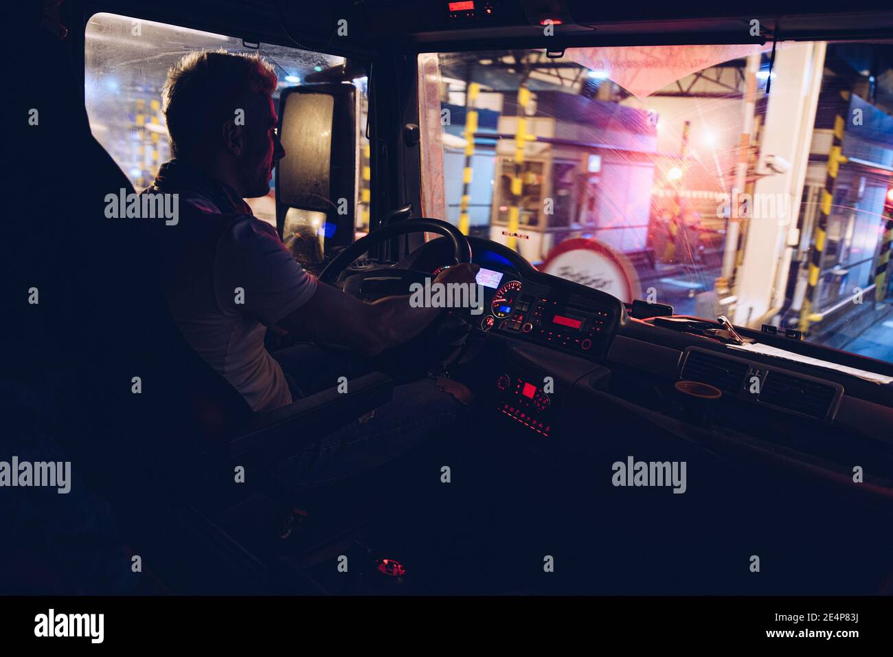 Handsome driver at the wheel of the truck Stock Photo - Alamy