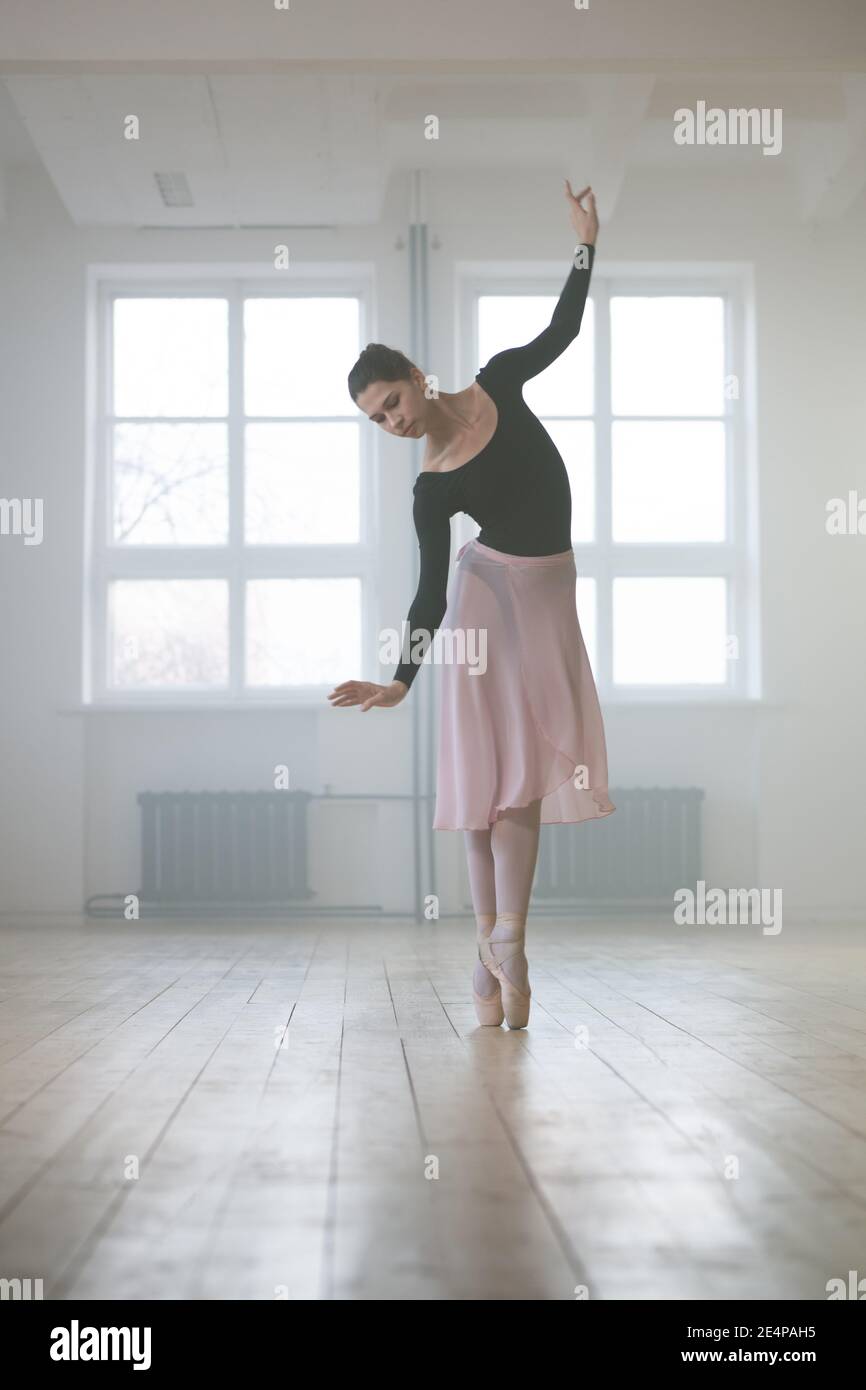 Female ballet dancer keeping the rack in class during her training ...