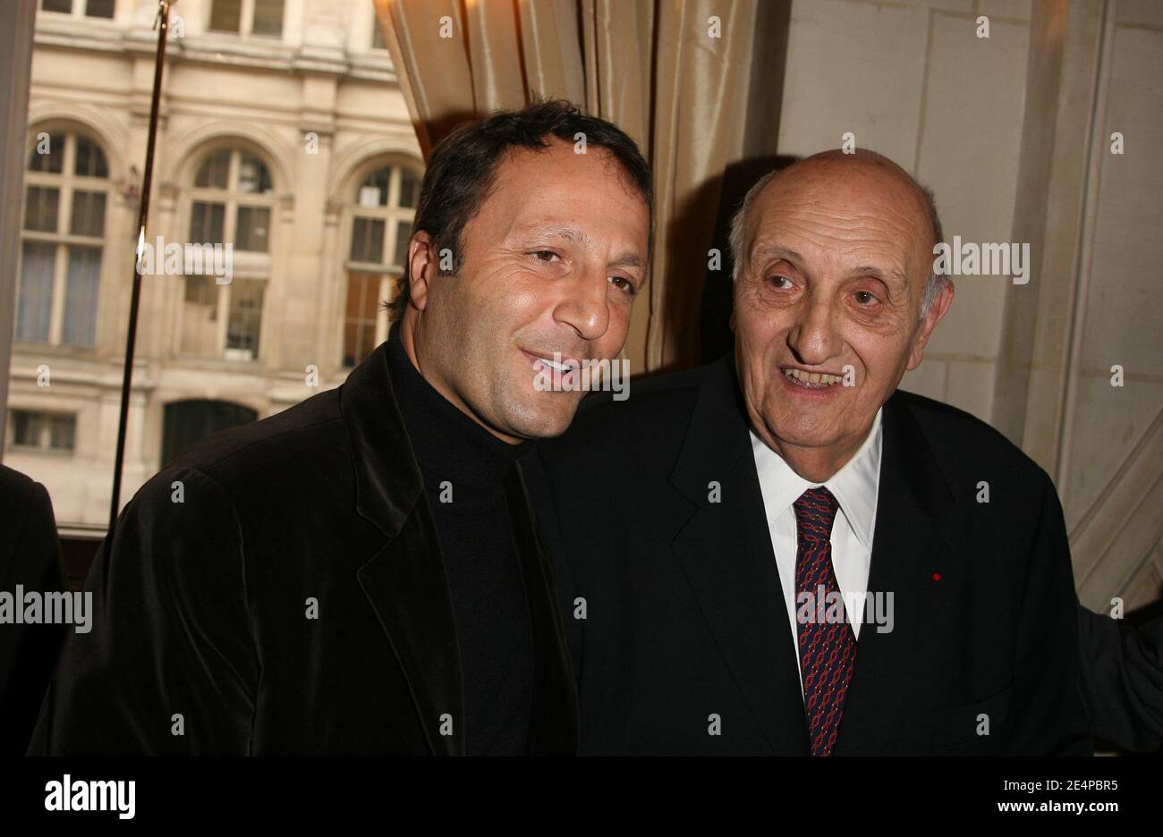 Pierre Tchernia poses with TV presenter Arthur as he receives the Great ...