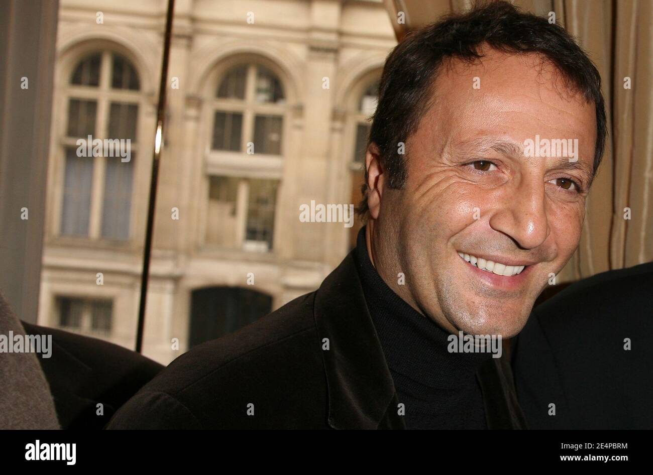 TV presenter Arthur poses at the Paris City Hall as Pierre Tchernia ...