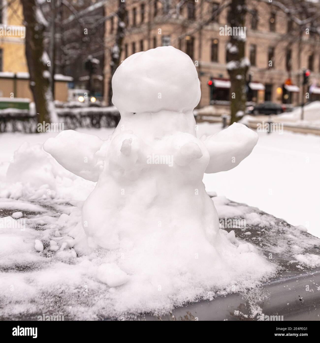 Snowman, snow woman molded from snow. Snowy winter concept. High ...