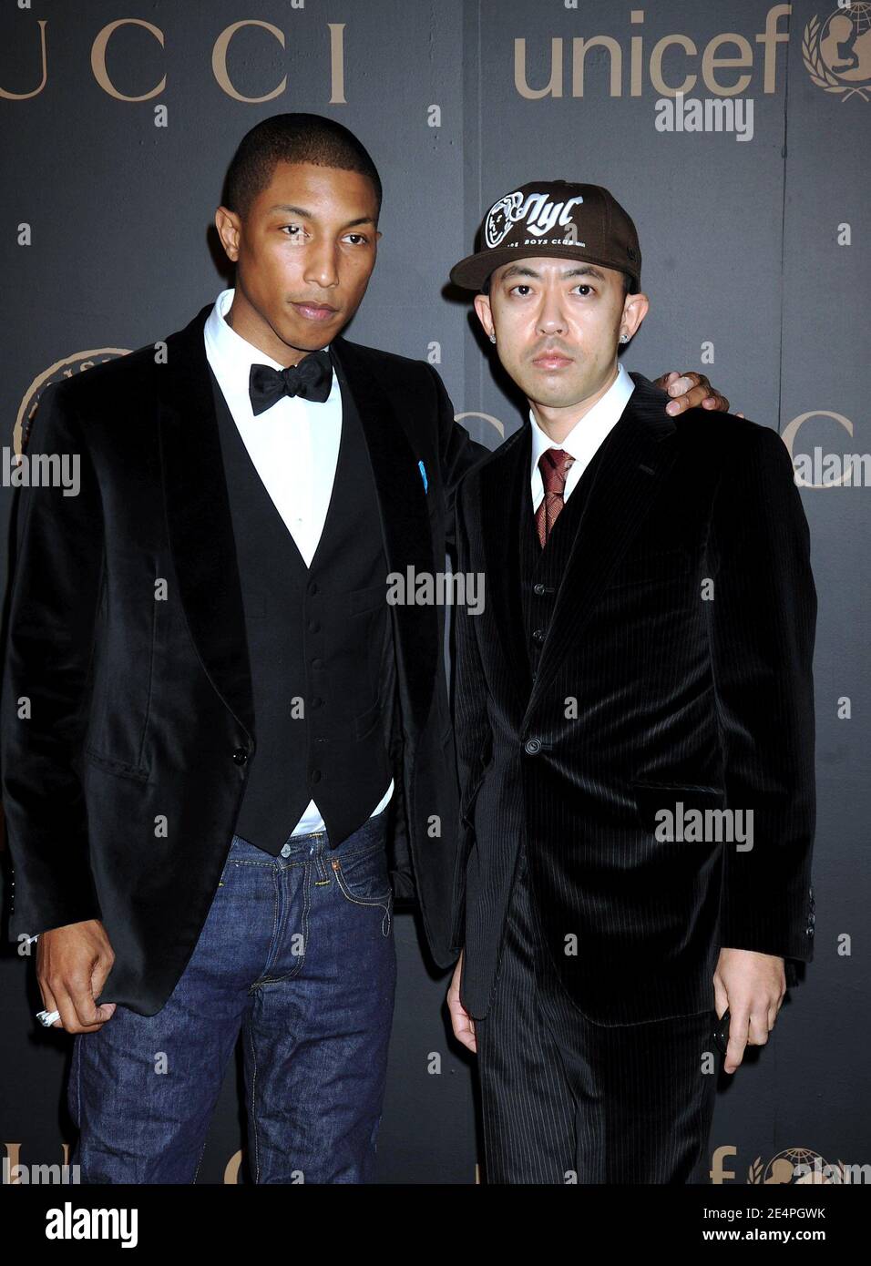 Pharrell Williams (L) and Nigo arriving for the Gucci and Madonna host ...