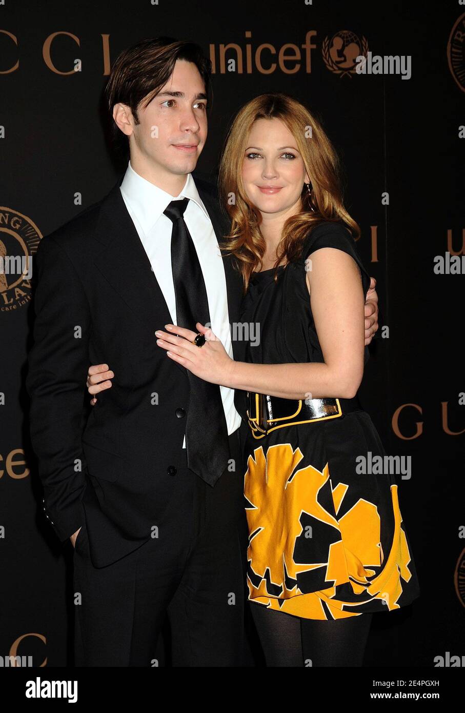 Justin Long and Drew Barrymore arriving for the Gucci and Madonna host ...