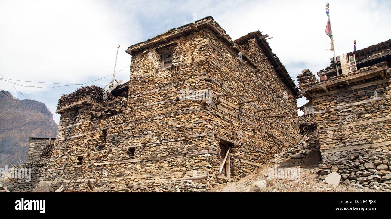 View of local stony building in Upper Pisang village one of the best ...