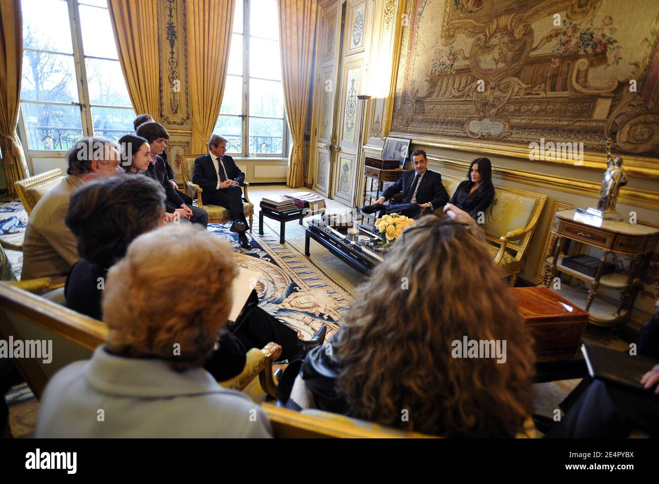 Nicolas Sarkozy and his wife Carla Bruni receive the Betancourt family ...