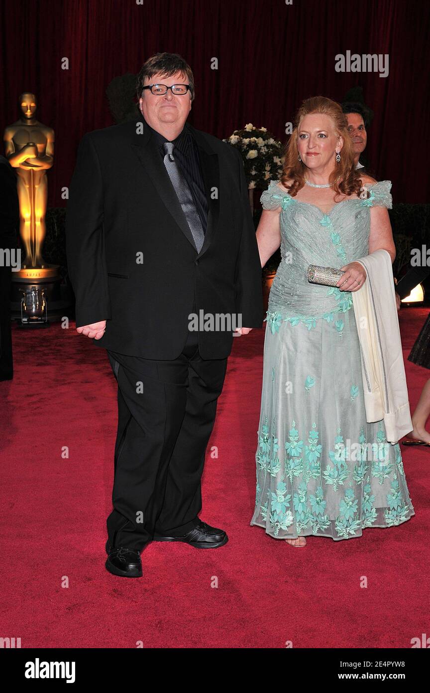 Director Michael Moore and his wife arrive at the 80th Academy Awards ...
