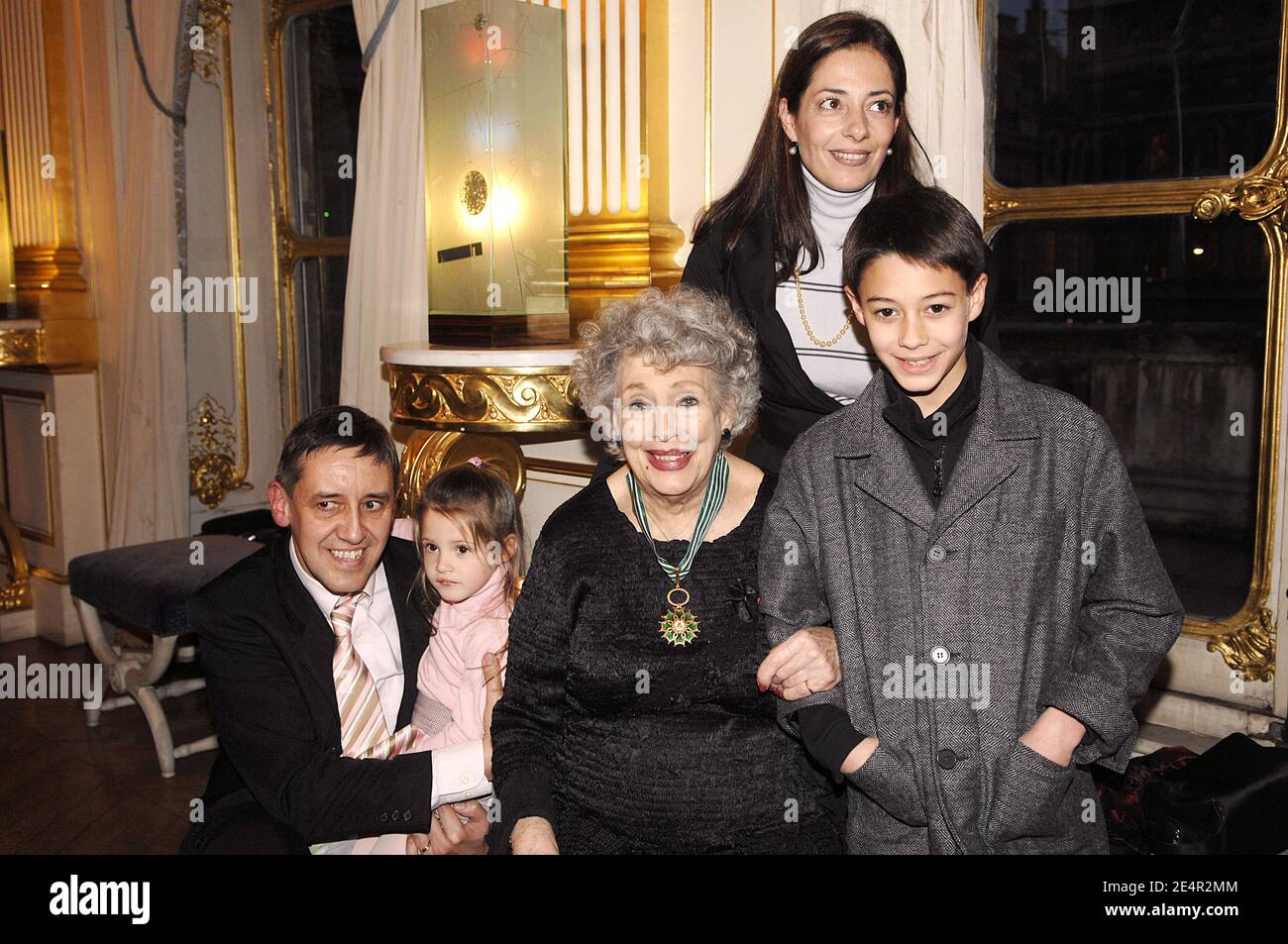 Micheline Dax poses with her family during a ceremony where she has ...