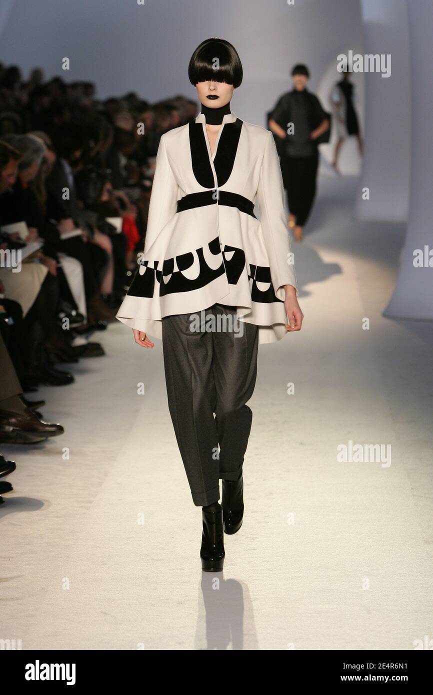 A model displays a creation by designer Stefano Pilati for Yves Saint ...