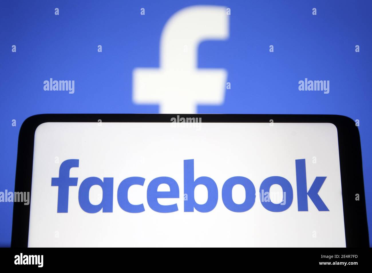 In this phot illustration the Facebook logo seen displayed on a mobile ...