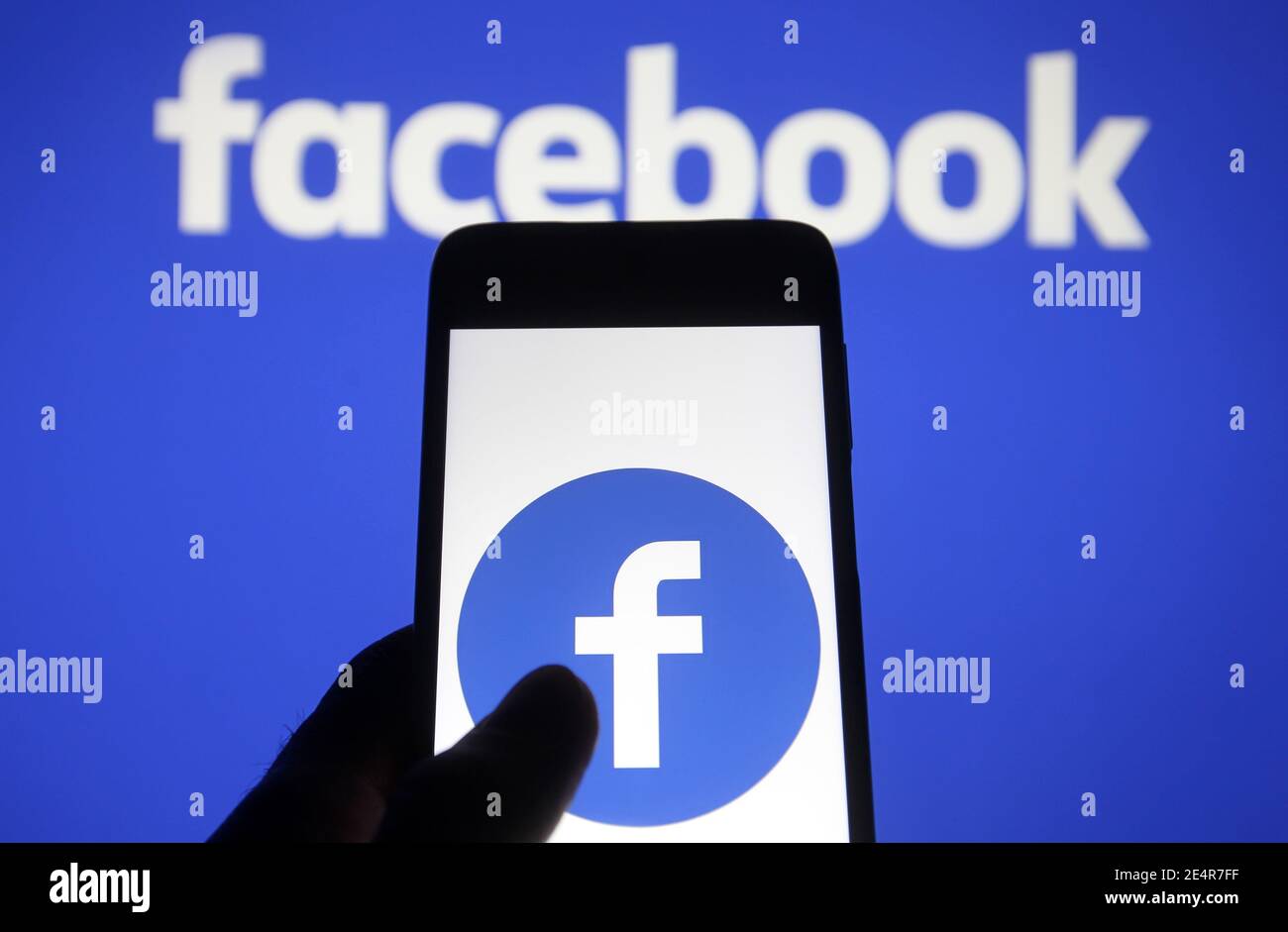 In this photo illustration the Facebook logo seen displayed on a mobile ...