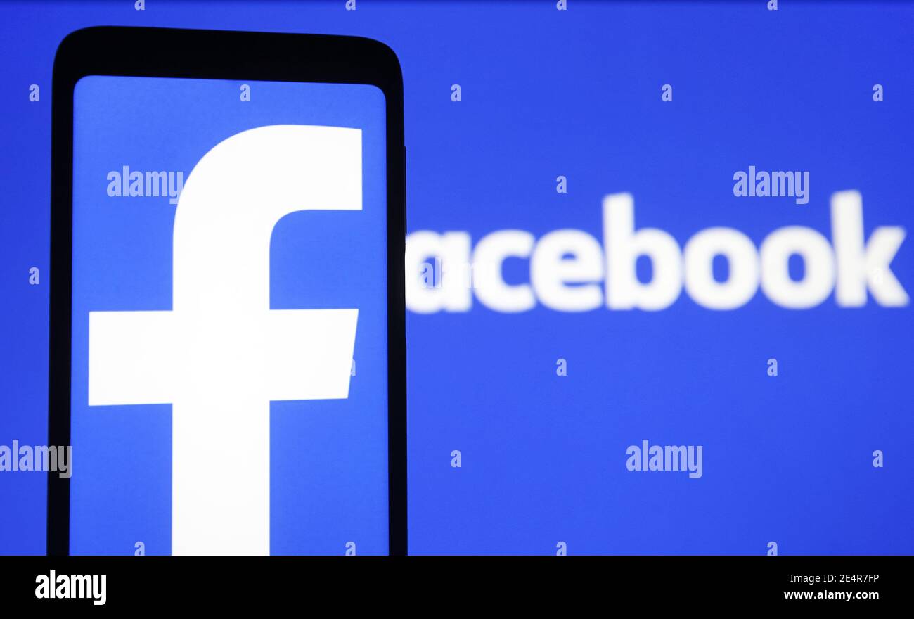 In this photo illustration the Facebook logo seen displayed on a mobile ...