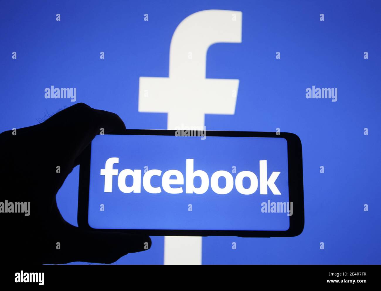 In this phot illustration the Facebook logo seen displayed on a mobile ...