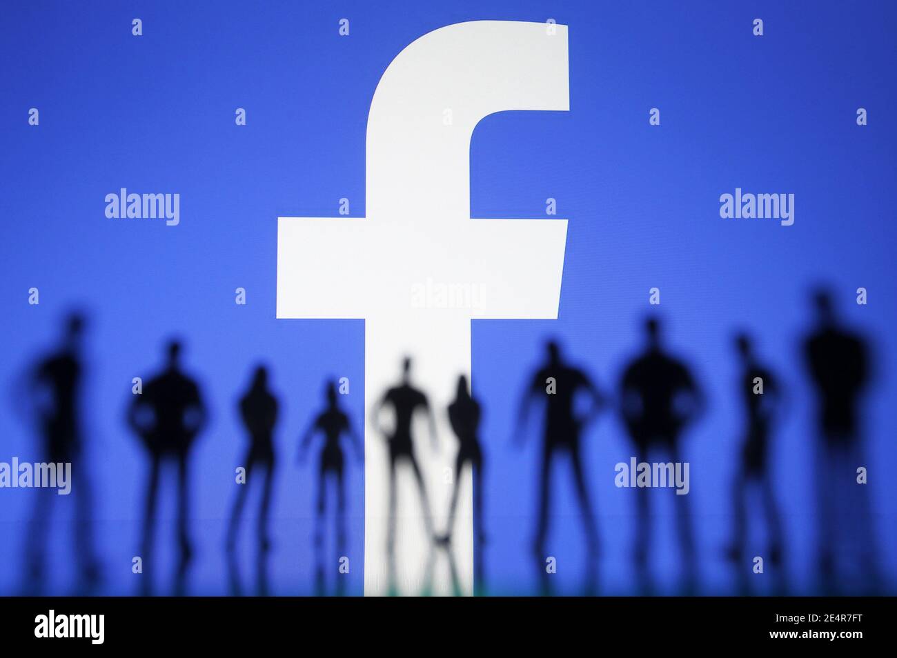 In this photo illustration silhouettes of toy people seen with the ...