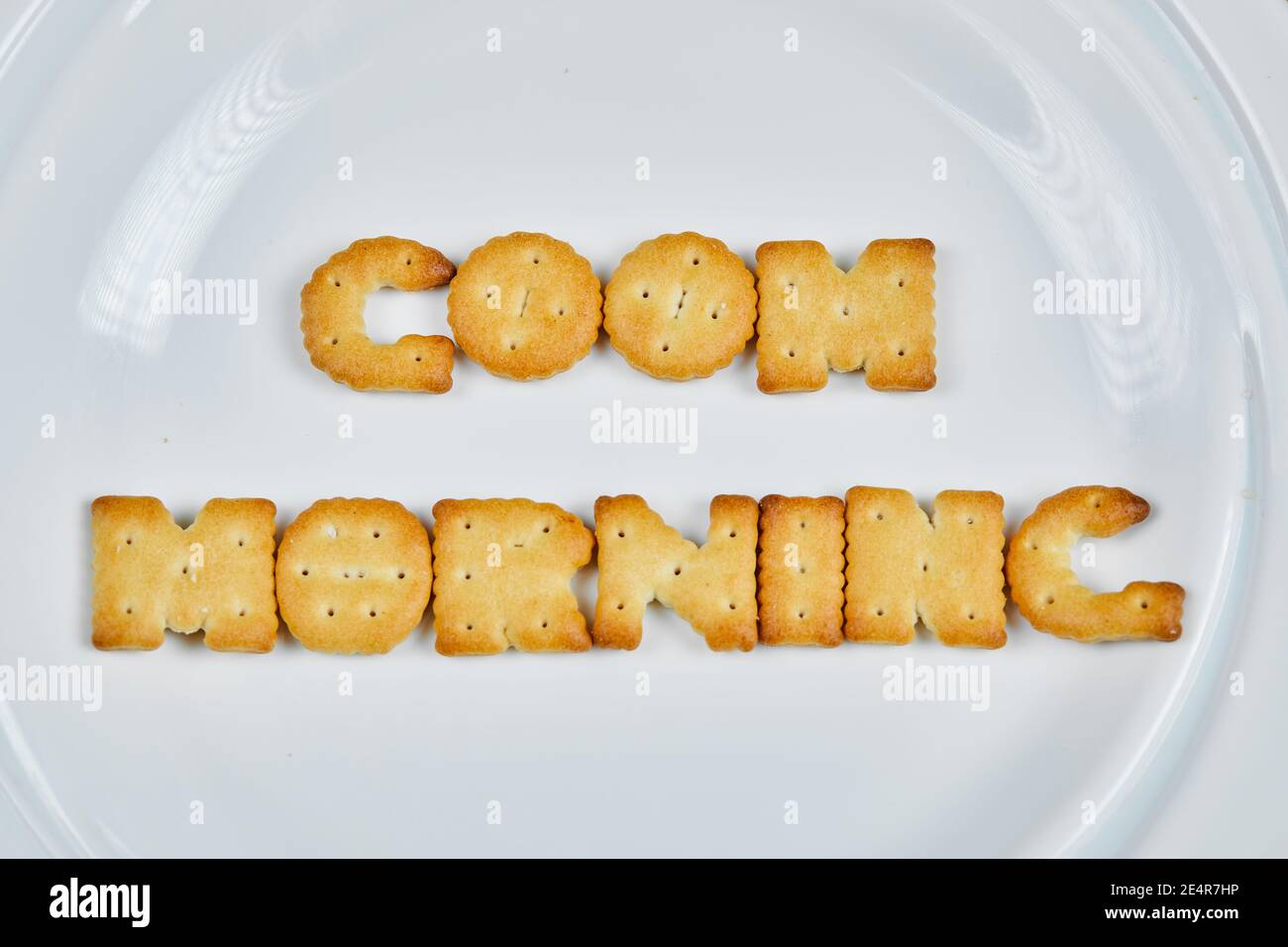 Word good morning spelled with crackers on a white plate Stock Photo ...