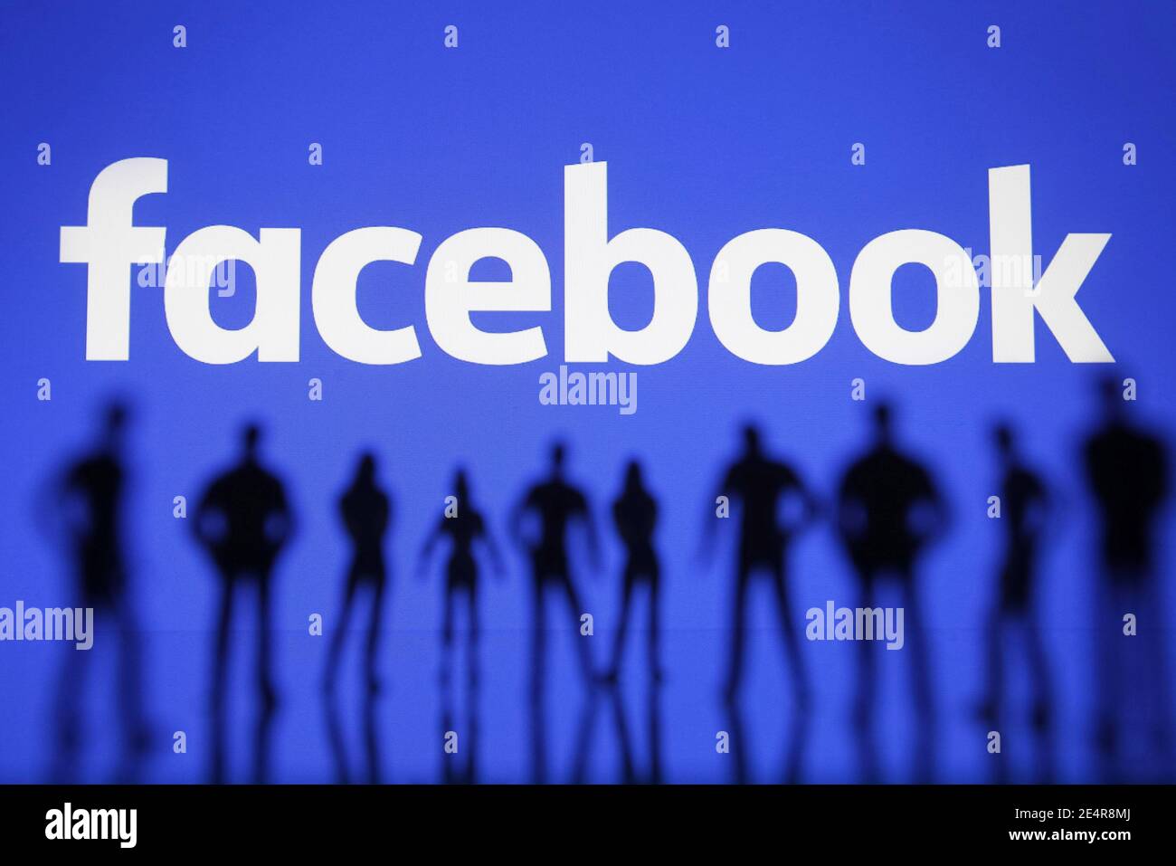 In this photo illustration the Facebook logo seen displayed in front of ...