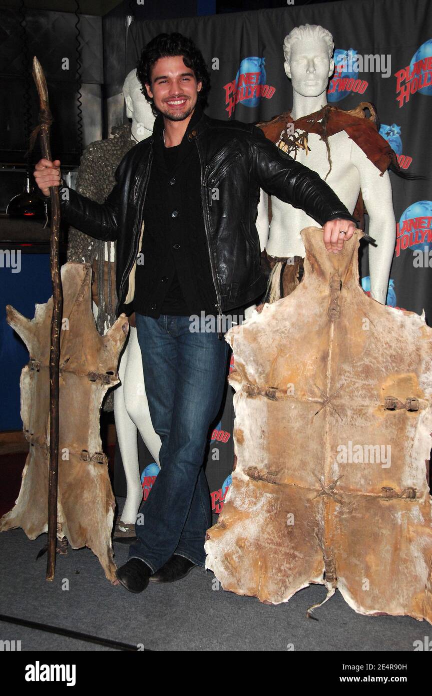 Actor Steven Strait poses as he donates costumes from his upcoming film ...