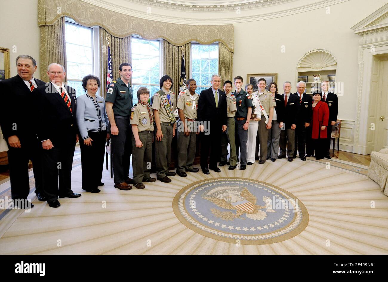 President George W. Bush (C) stands with members of Boy Scouts during a ...