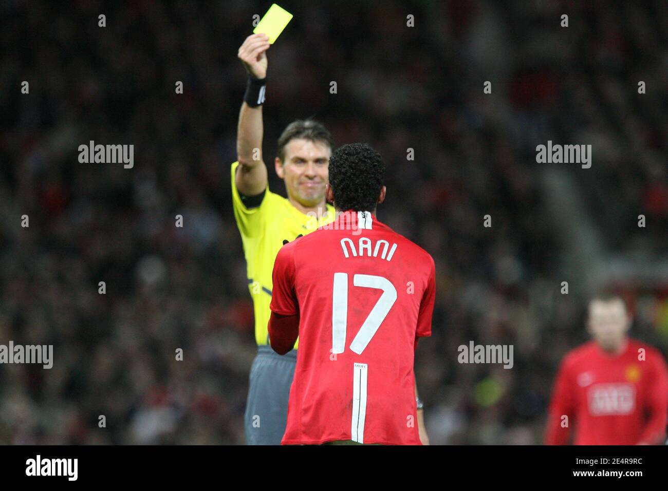 Manchester United's Luis Nani receives a yellow card during the UEFA ...