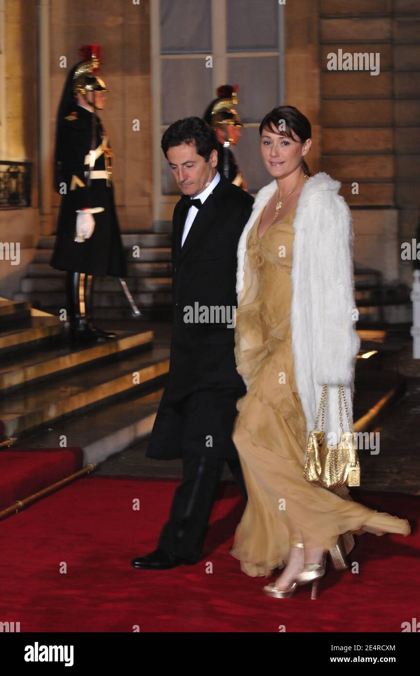 French TV journalist Daniela Lumbroso and husband Eric Ghebali arrive ...
